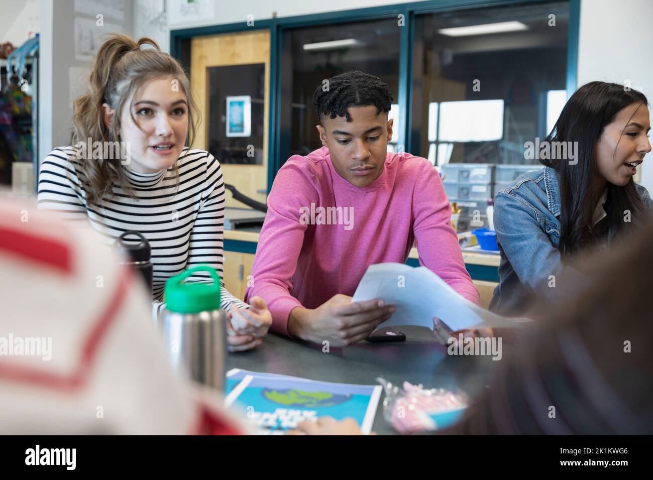 Two students talking at desk hi-res stock photography and images - Alamy