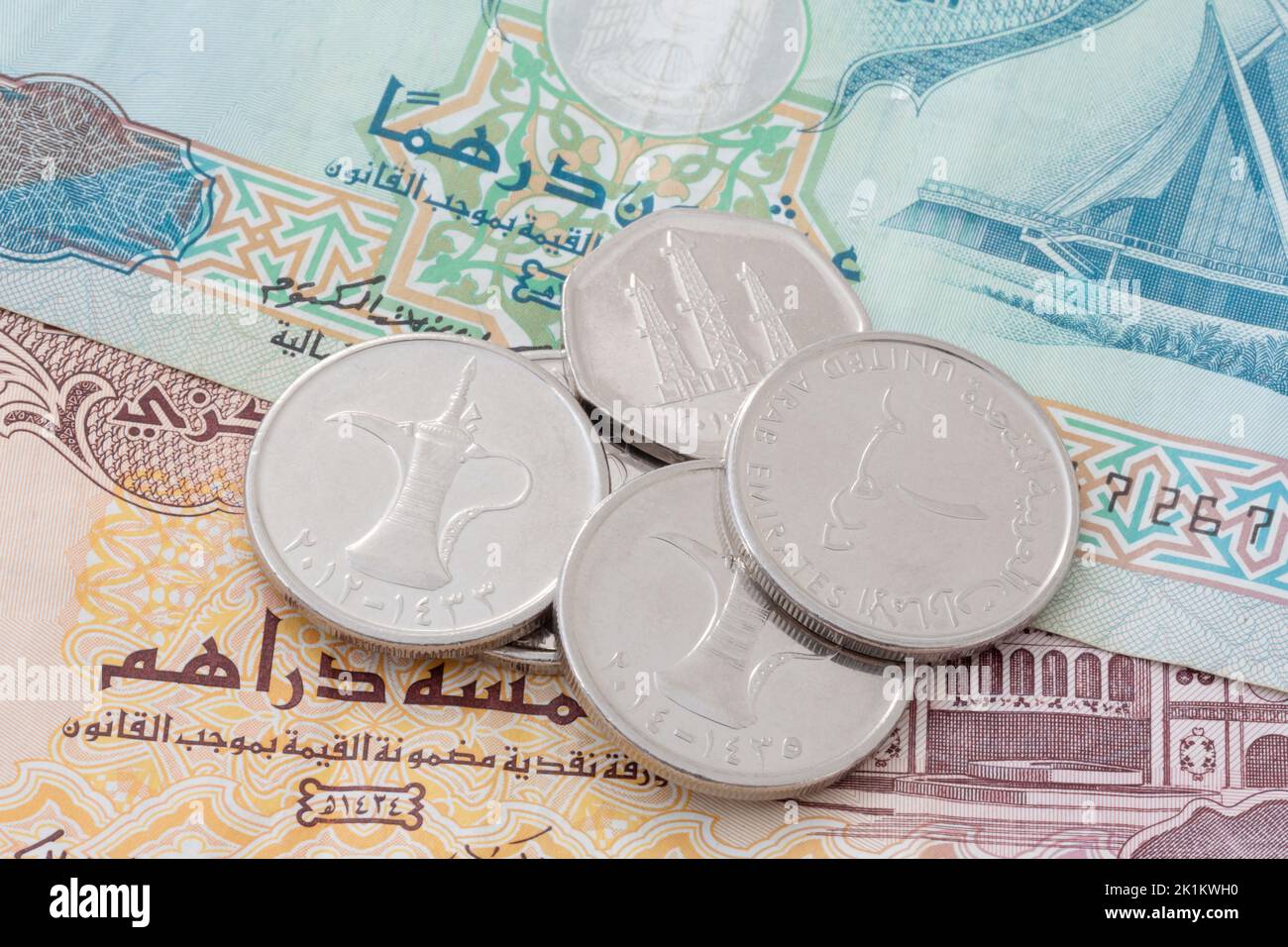 close up of United Arab Emirates dirham coins lying on banknotes Stock ...