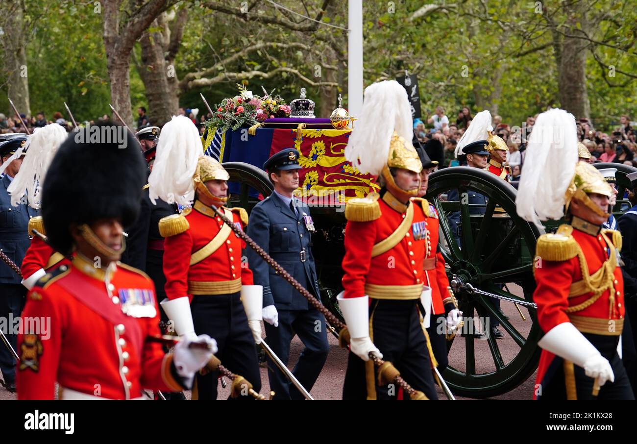 The coffin procession walks down The Mall, central London after the Ste ...