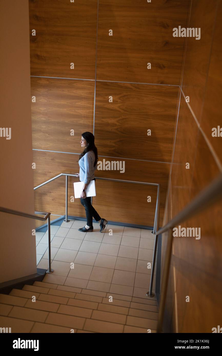 Busy woman walking modern office hi-res stock photography and images ...