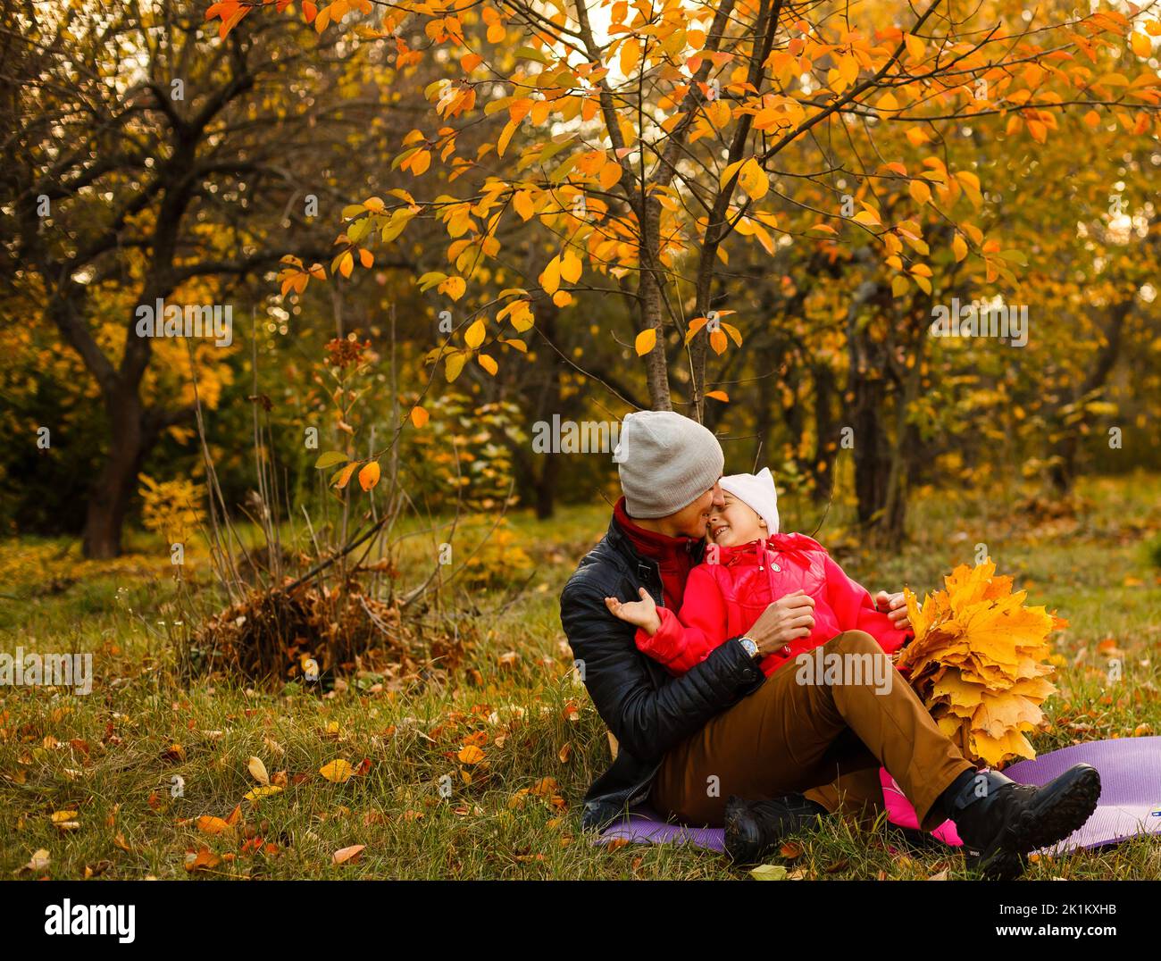 Happy family. daughter kissing and hugging her dad on a walk in the ...