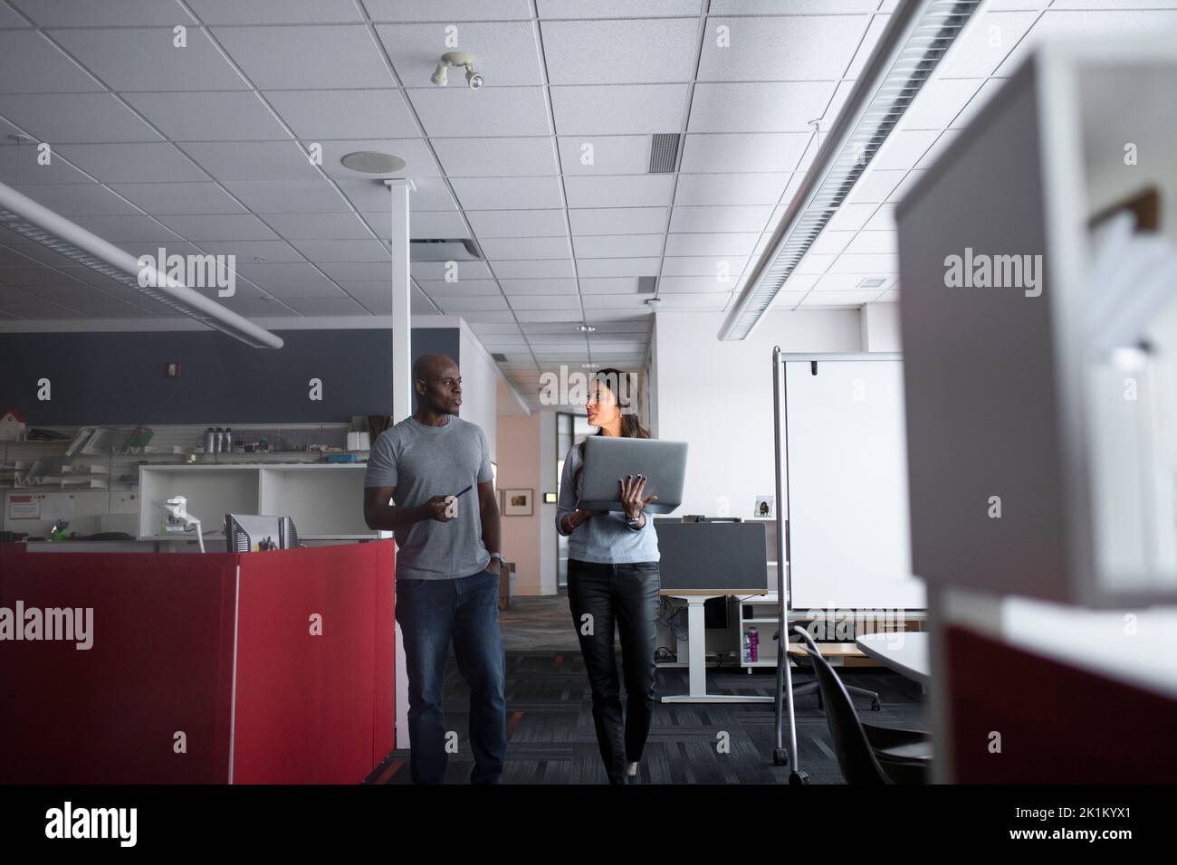 Woman walking down corridor hi-res stock photography and images - Alamy