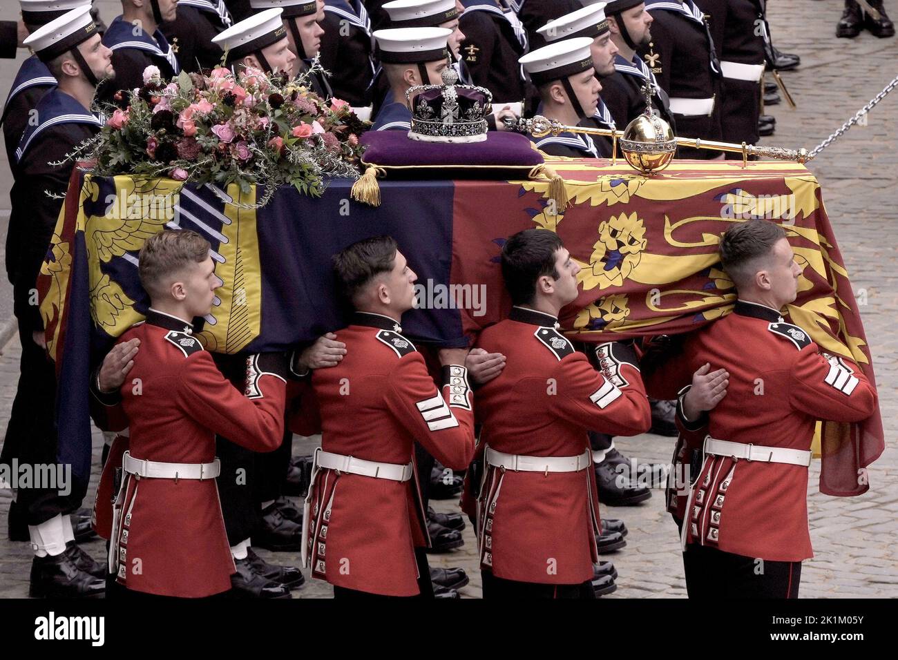 The coffin of Queen Elizabeth II is loaded on to a gun carriage pulled ...