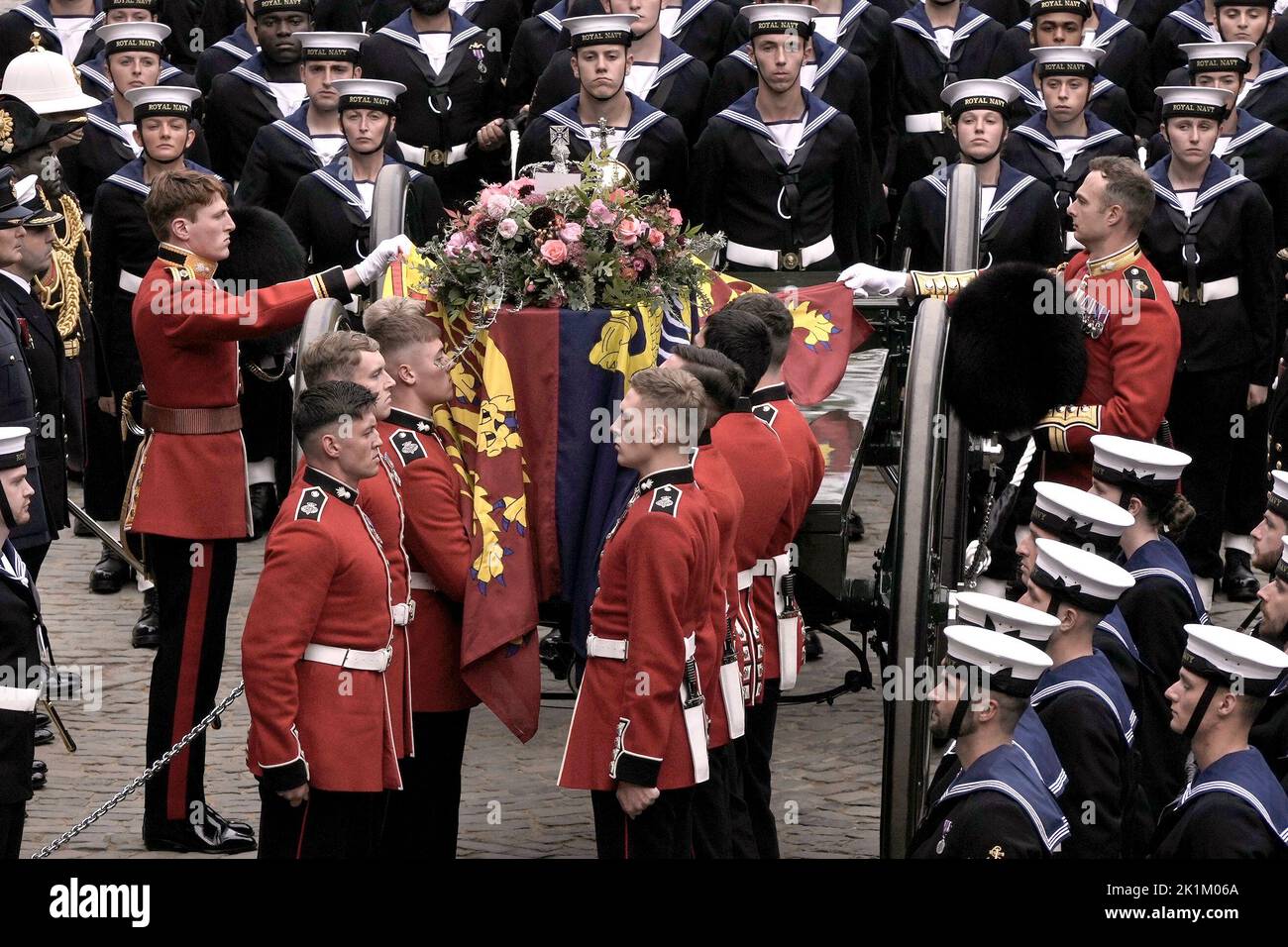 The coffin of Queen Elizabeth II is loaded on to a gun carriage pulled ...