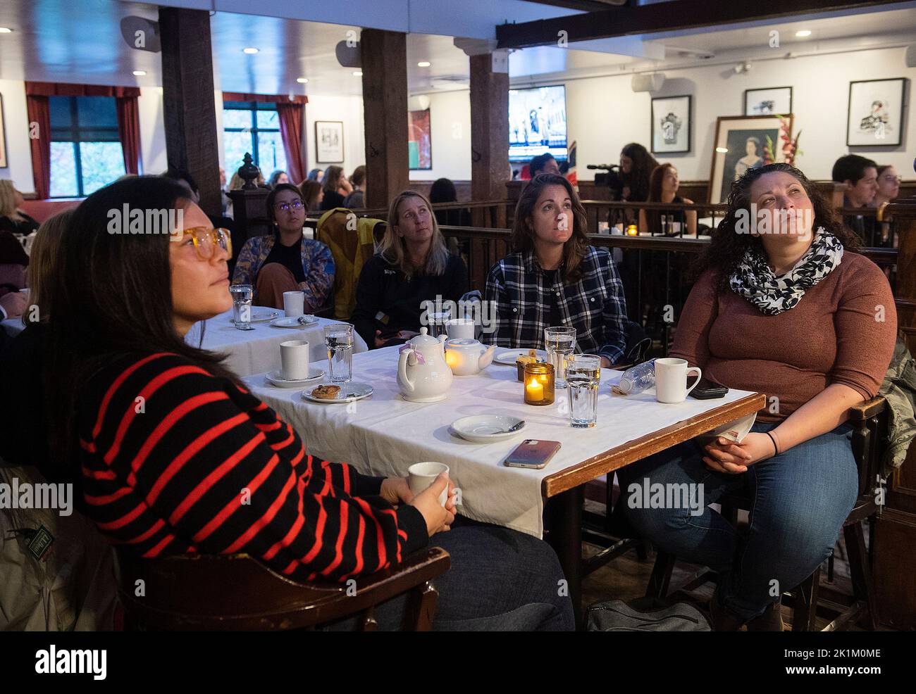 People watch the funeral of Queen Elizabeth at the Burgundy Lion pub in ...