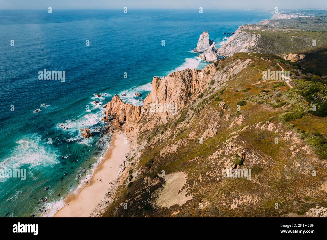 Aerial drone view of Ursa Beach near Cabo da Roca, Portugal with hiking ...