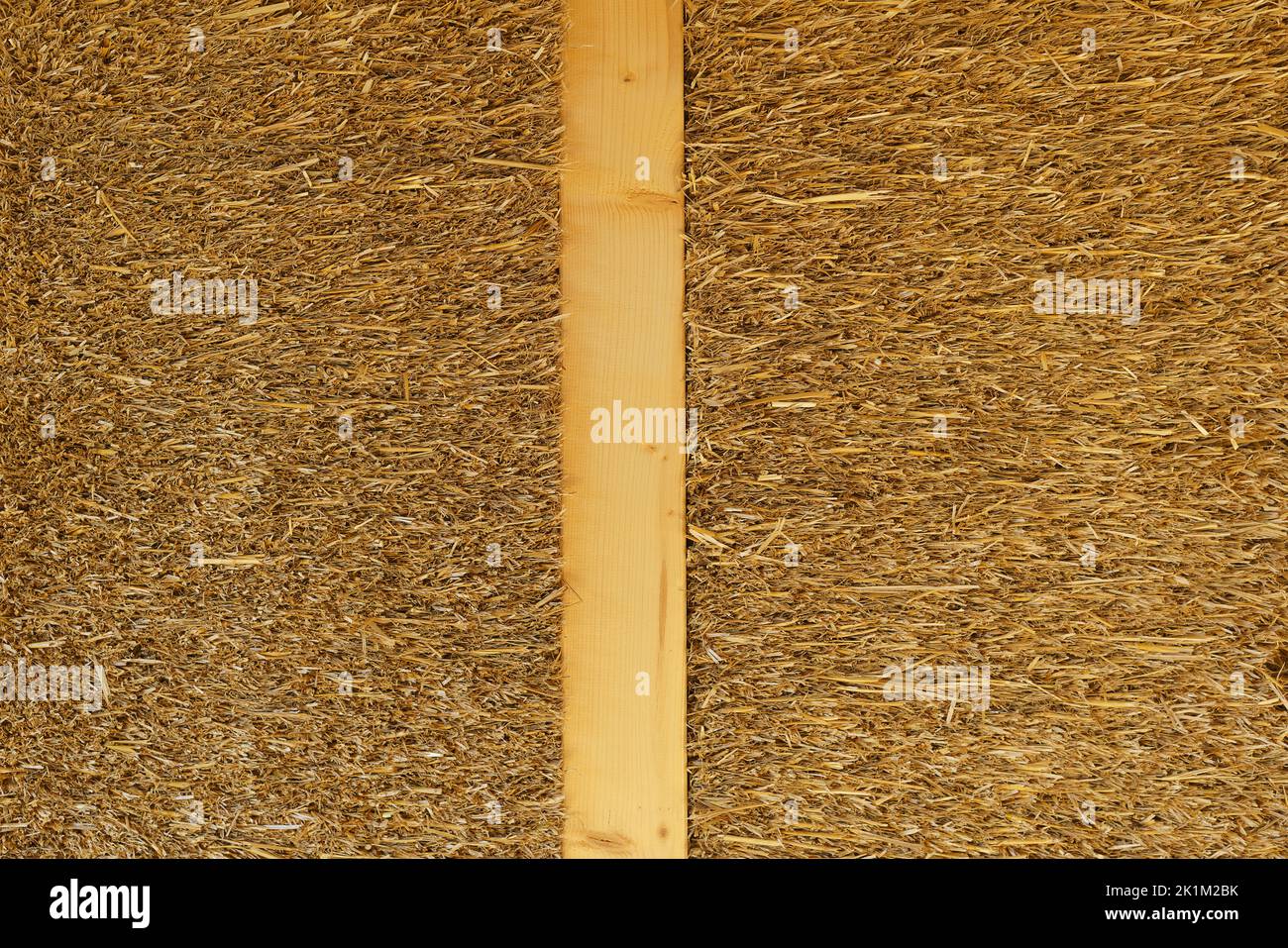 Close-up of straw-wooden detail at construction of ecological renewable ...
