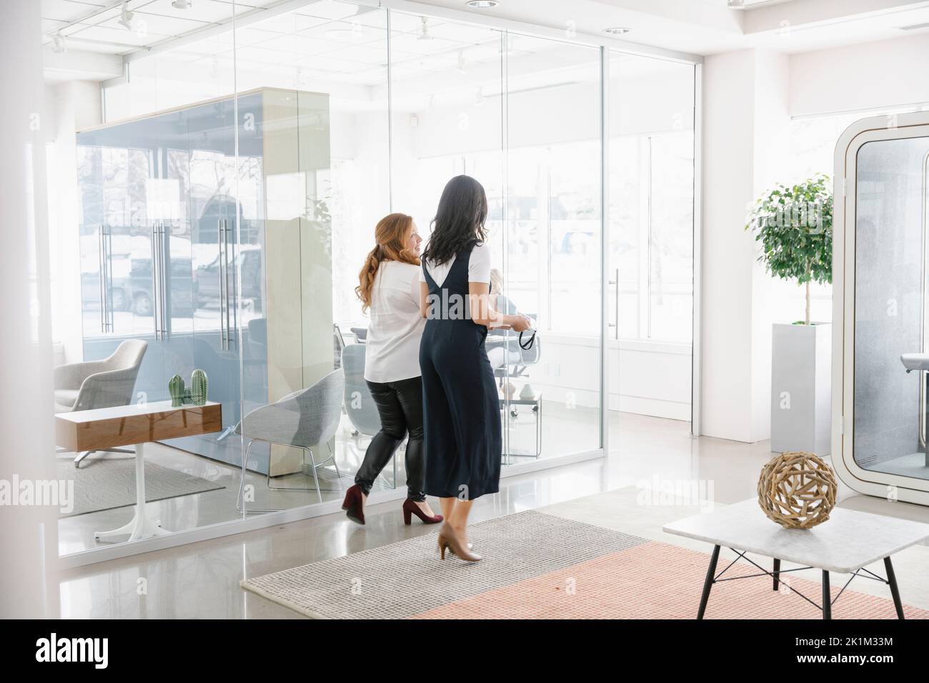 Busy woman walking modern office hi-res stock photography and images ...