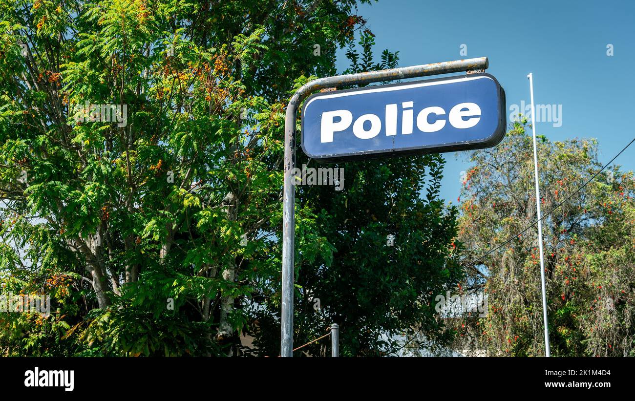 Old peeling blue Police sign Stock Photo - Alamy