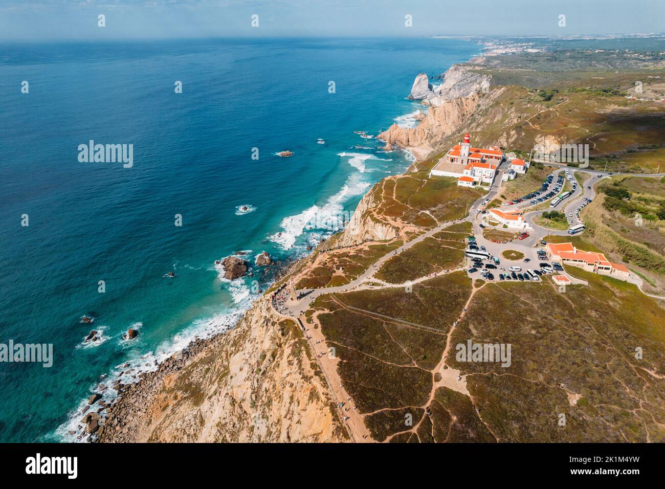Aerial drone view of lighthouse at Cabo da Roca with unidentifiable ...