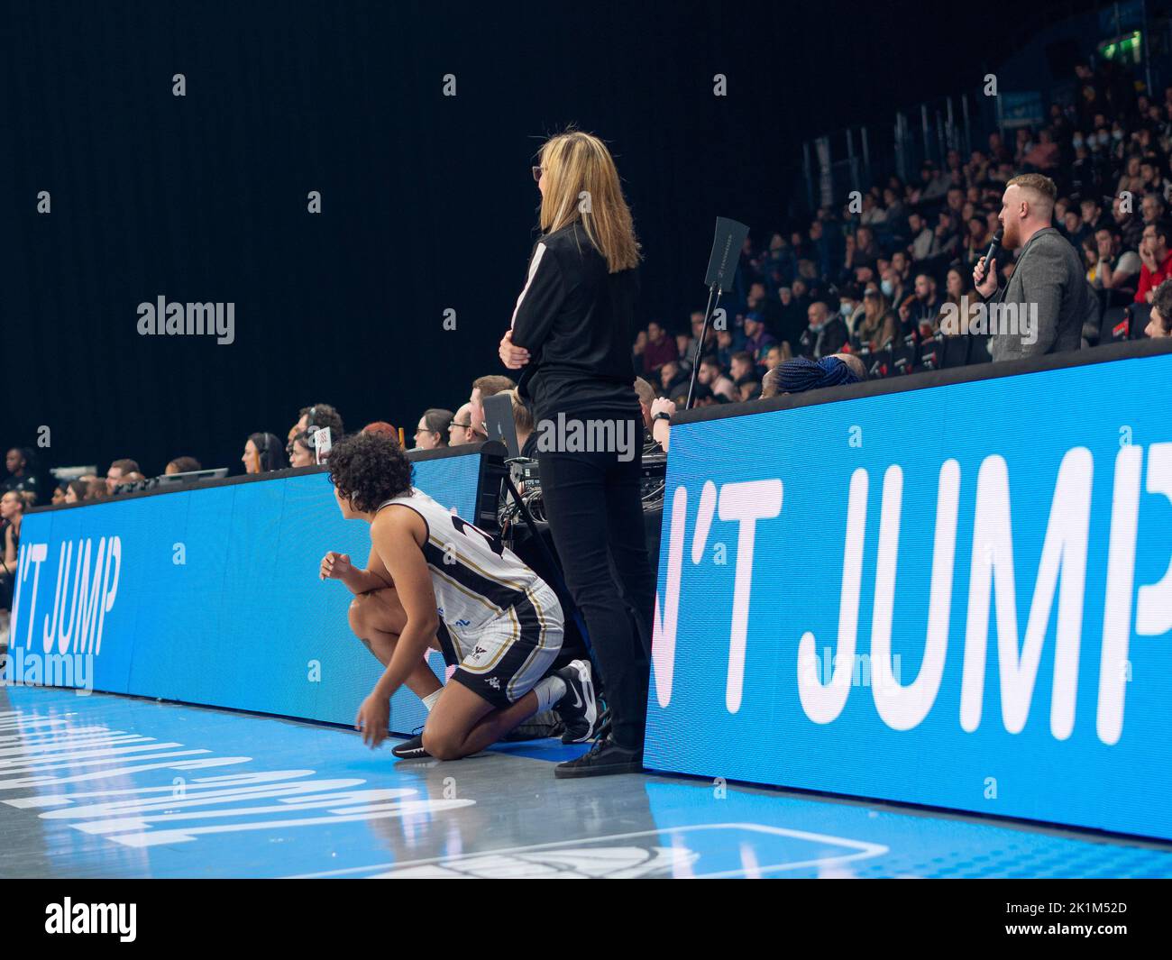 Birmingham, England. WBBL Cup Final, basketball player kneeling waiting ...