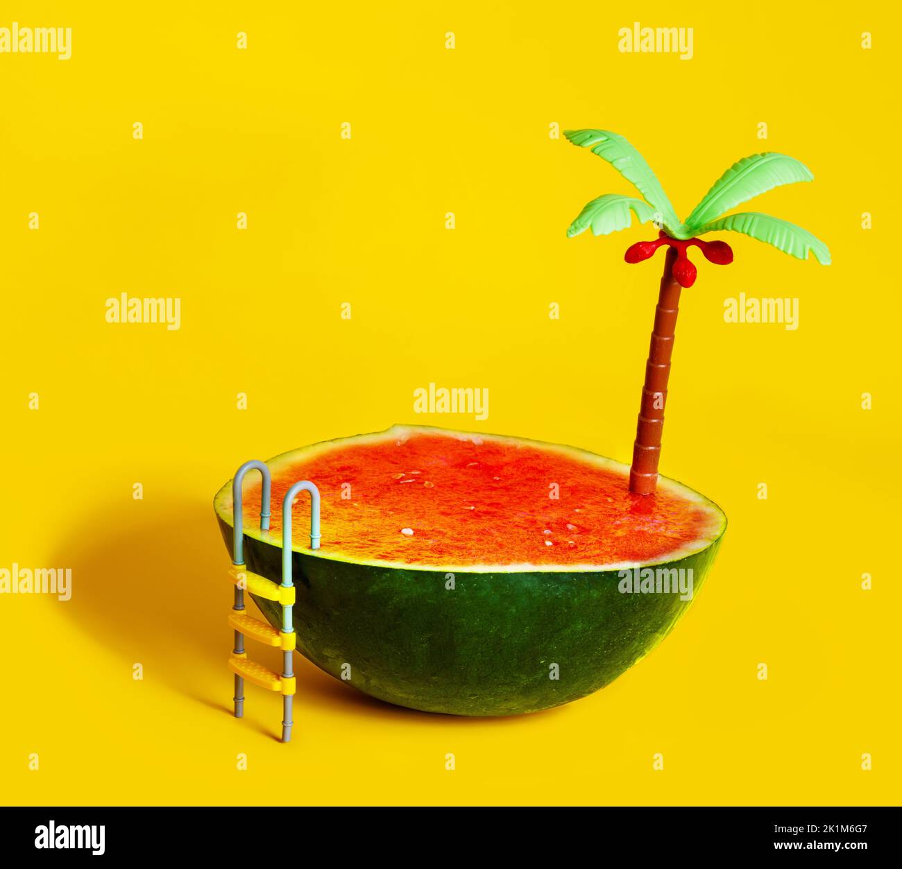 Watermelon juicy concept: fruit with pool ladder and palm tree Stock ...