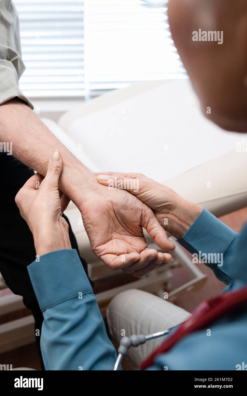 Doctor arm over shoulder hi-res stock photography and images - Alamy