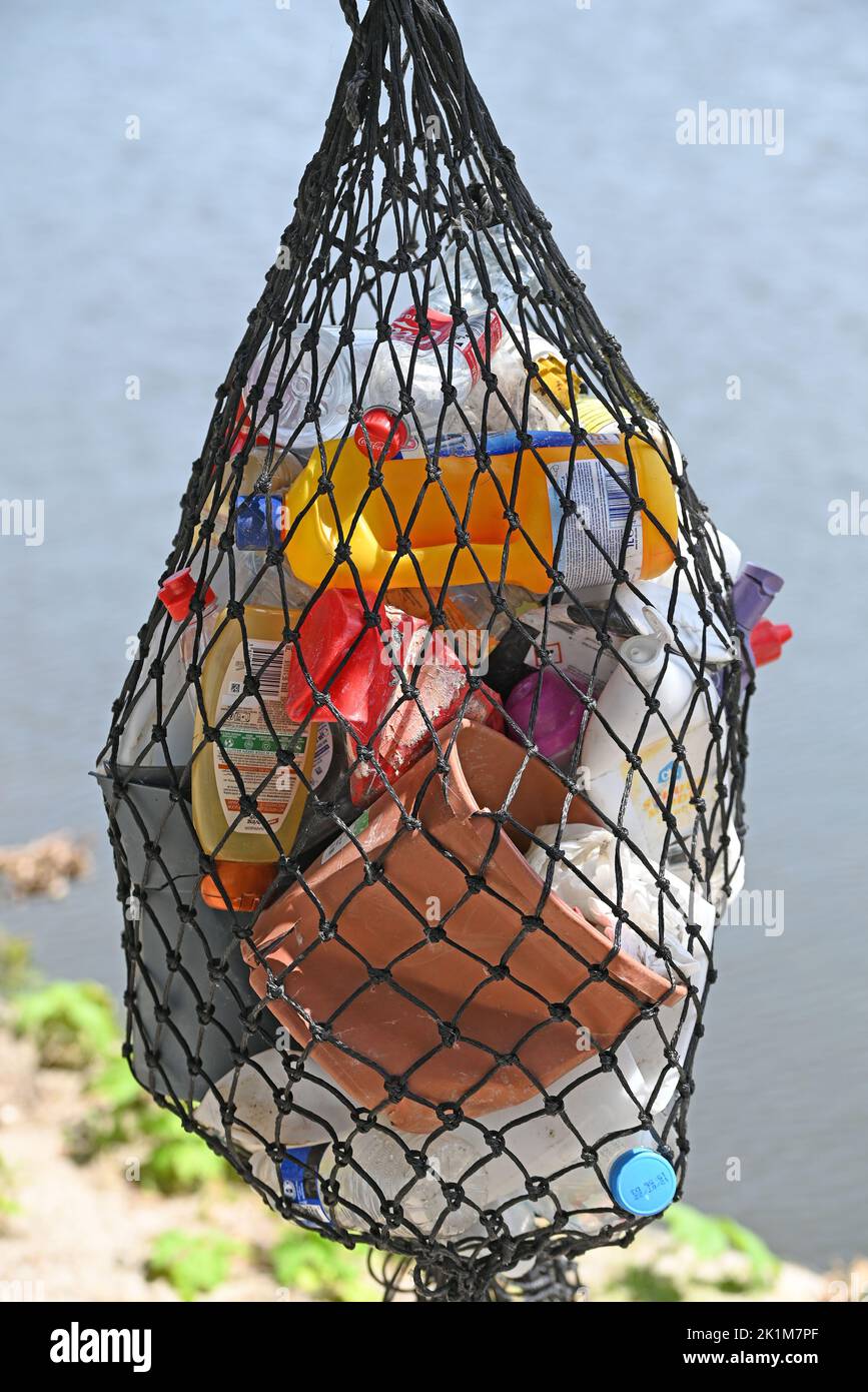 Plastic bottle waste for recycle collected in net Stock Photo - Alamy