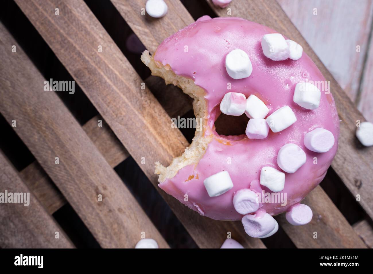 A top view of a bitten donut with marshmallows Stock Photo - Alamy