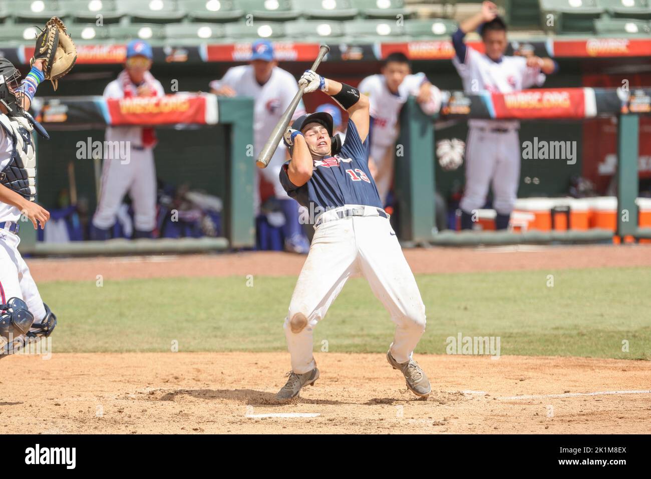 Sarasota, FL. USA; Team USA first baseman Stone Russell (13) jumps out ...