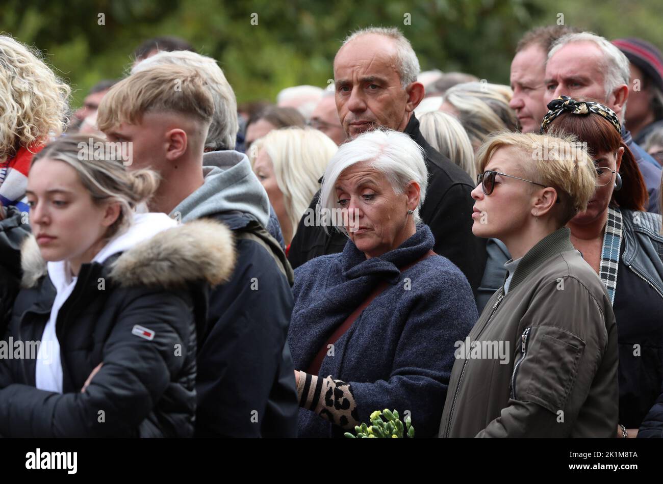 London, UK. 19th Sep, 2022. Members of the public watch the funeral ...