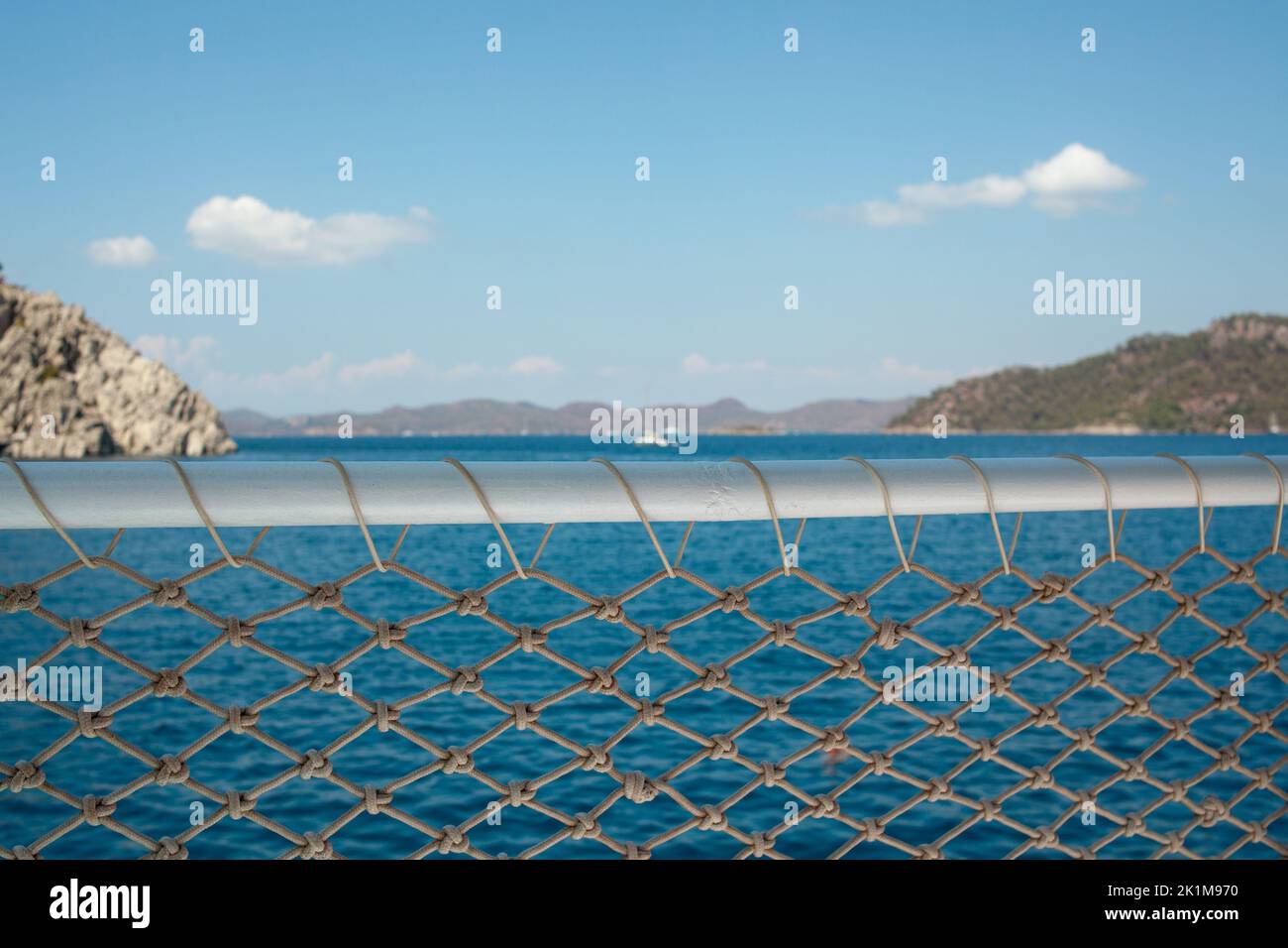 Rope net texture against blue sea background. A material net attached ...