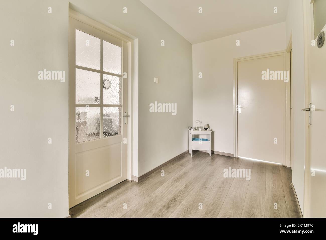 Table with chairs located near lounge area and dining in spacious room ...