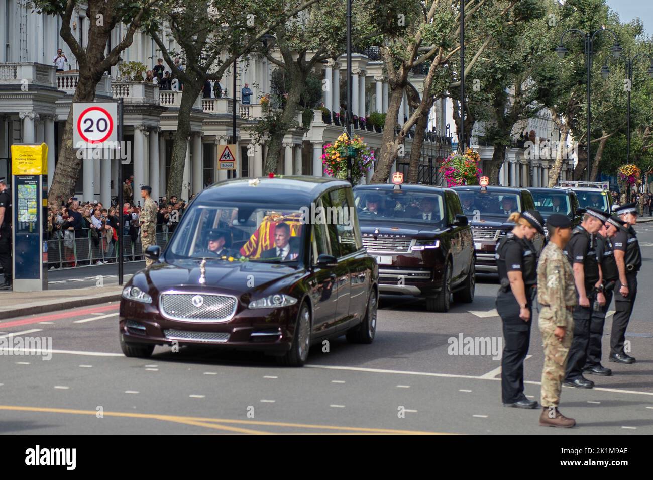 The hearse carrying the coffin of the late Queen Elizabeth II travels ...