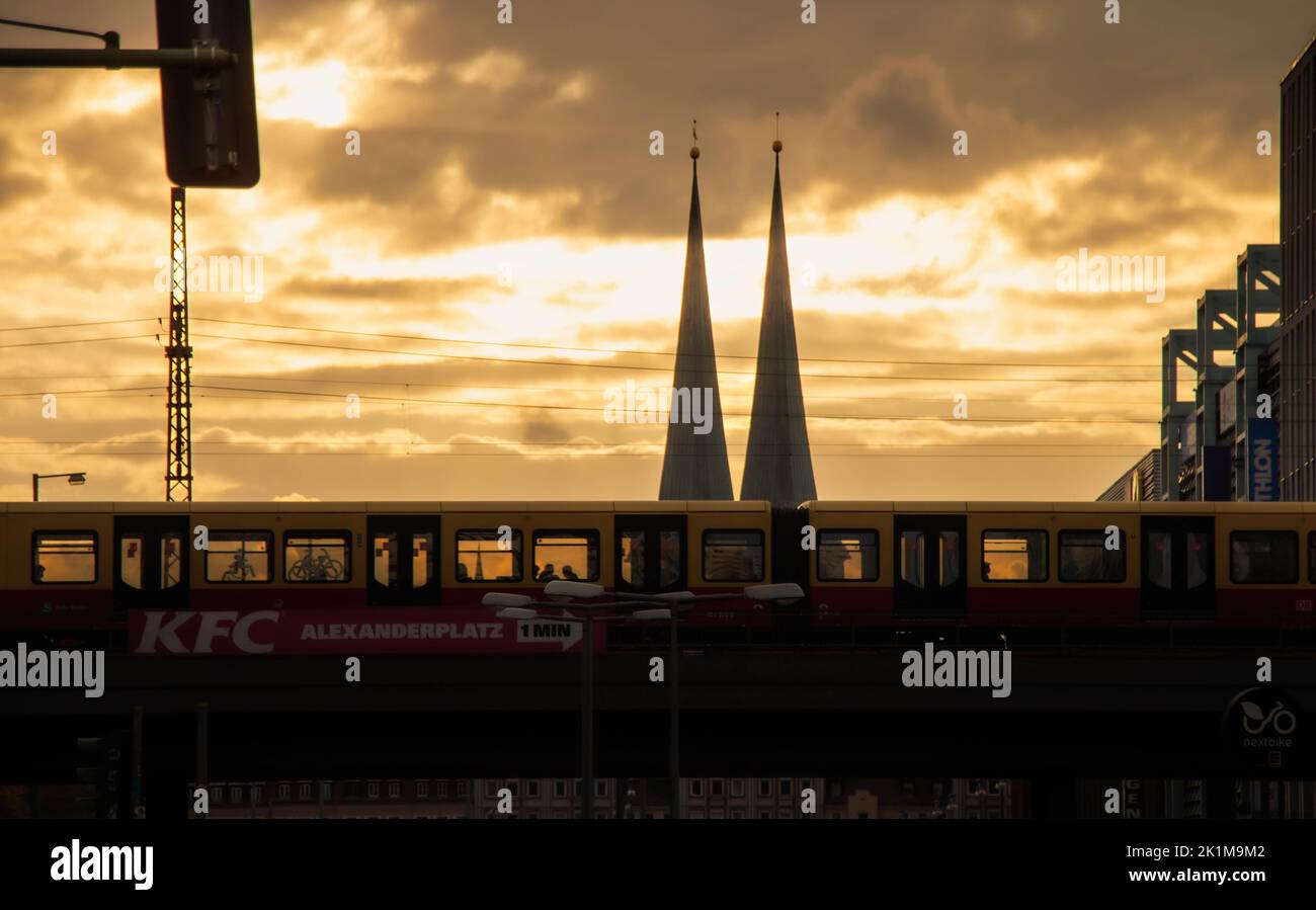 A scenic view of an S-Bahn subway train moving with towers and a ...