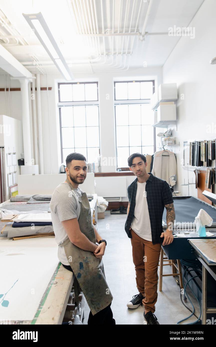 Portrait of two men in screenprinting studio Stock Photo - Alamy