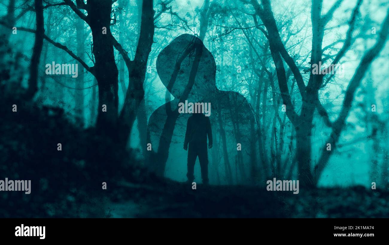 A dark, horror concept of a double exposure of a ghostly hooded figure ...