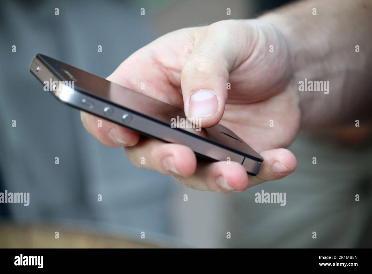 Typing on an old smartphone Stock Photo - Alamy