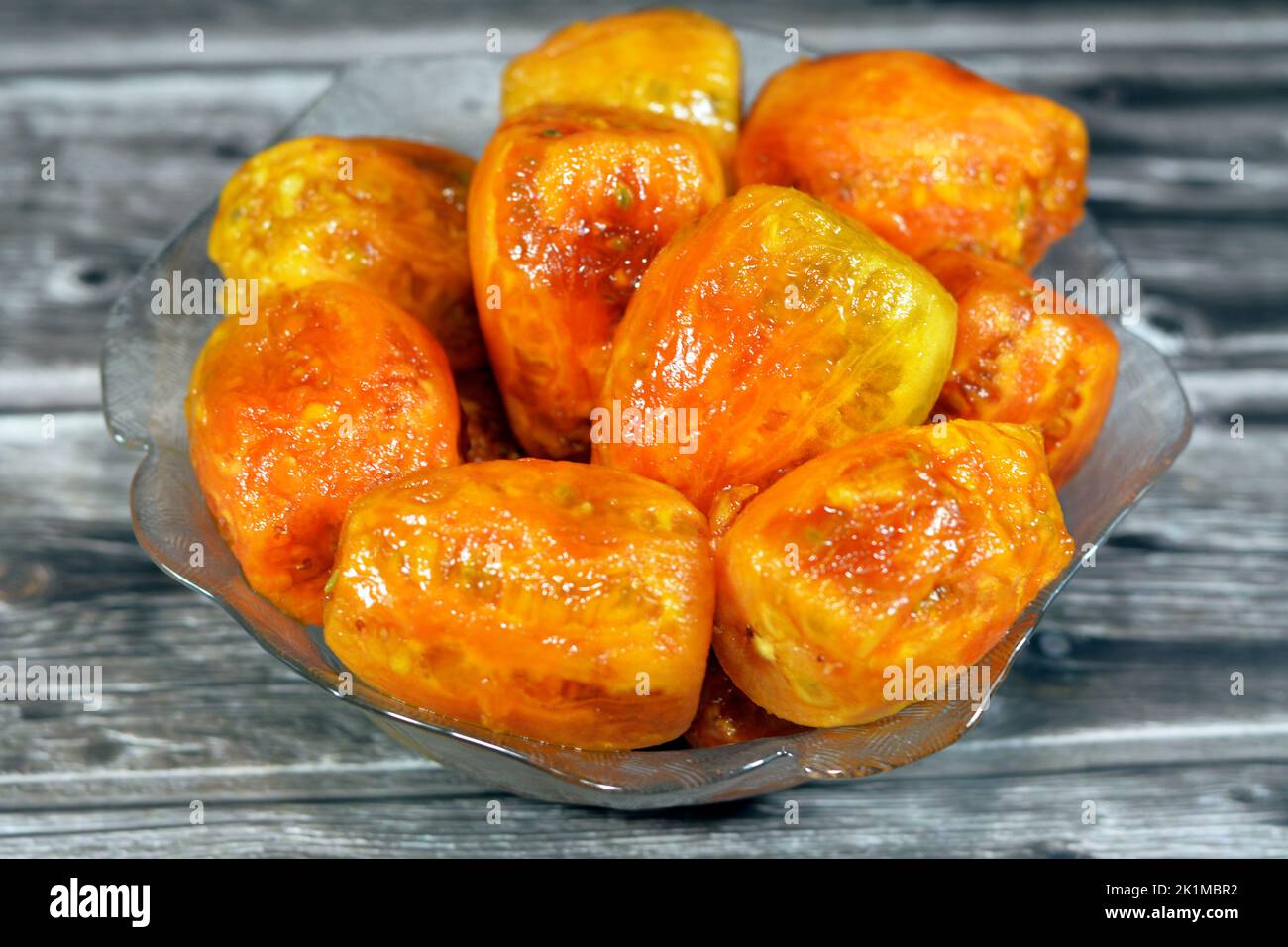 A pile of peeled fresh prickly pear fruit in a glass bowl isolated on ...