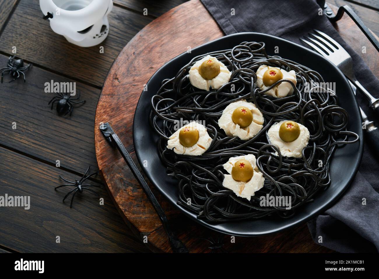 Halloween party Italian black pasta decorated horror olives like eyes ...