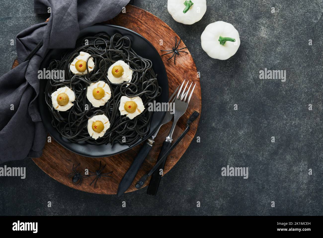 Halloween party Italian black pasta decorated horror olives like eyes ...