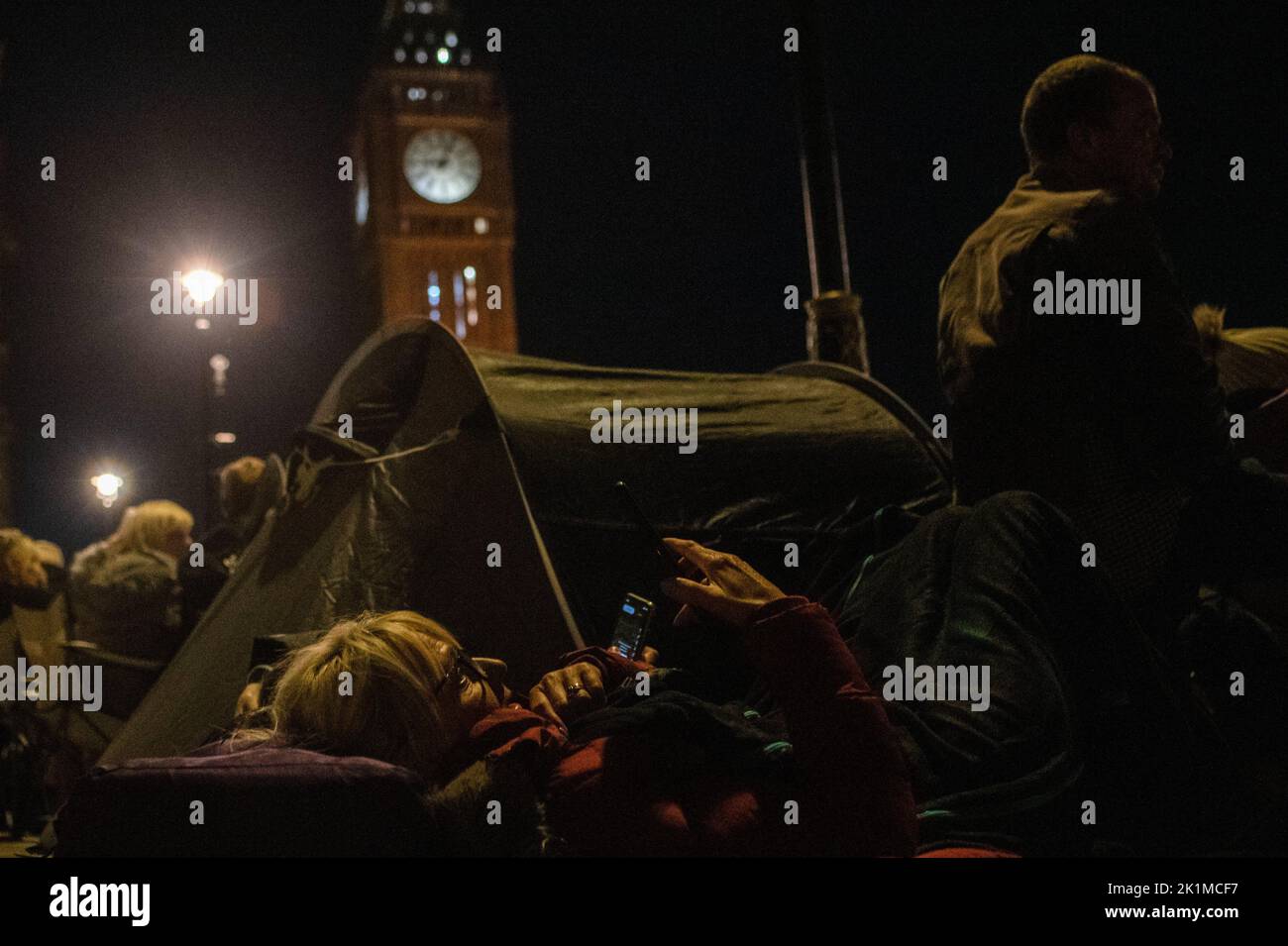 London, UK . 19th Sep, 2022. People camp out in the cold London night ...