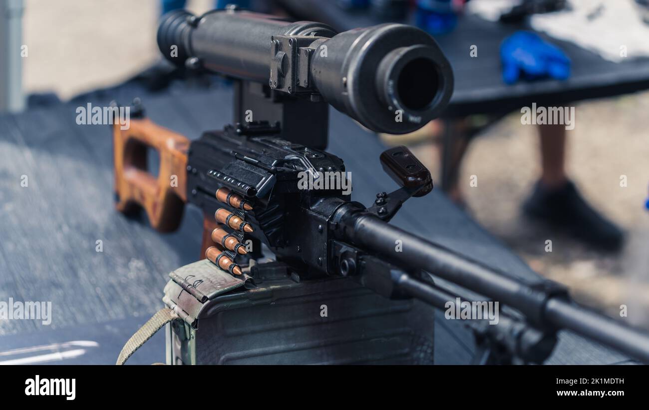 08.07.2022. Warsaw, Poland. closeup view of a machine gun with a loupe ...
