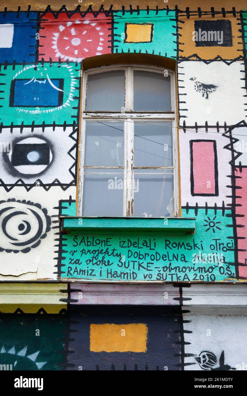 A vertical close-up shot of an old window on a graffiti wall Stock ...