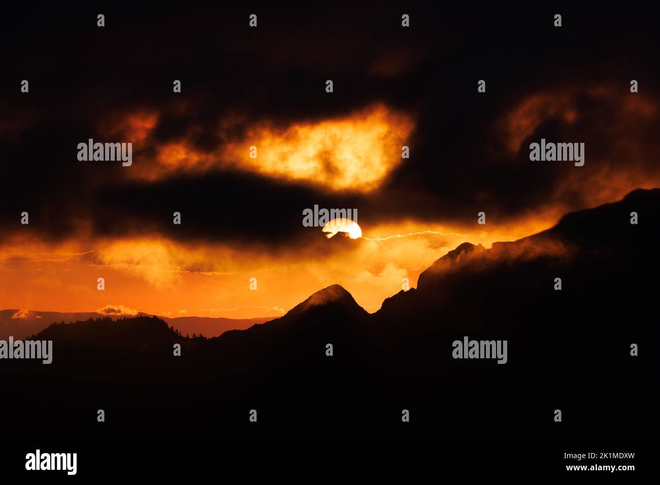 dramatic firy sunset in the fribourg alps Stock Photo - Alamy