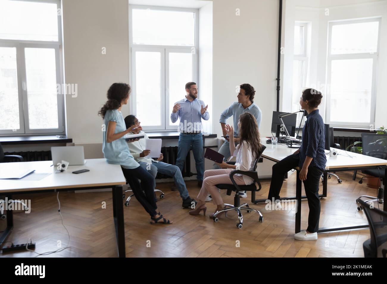 Happy confident business leader man motivating team Stock Photo - Alamy Happy confident business leader man motivating team Stock Photo - Alamy