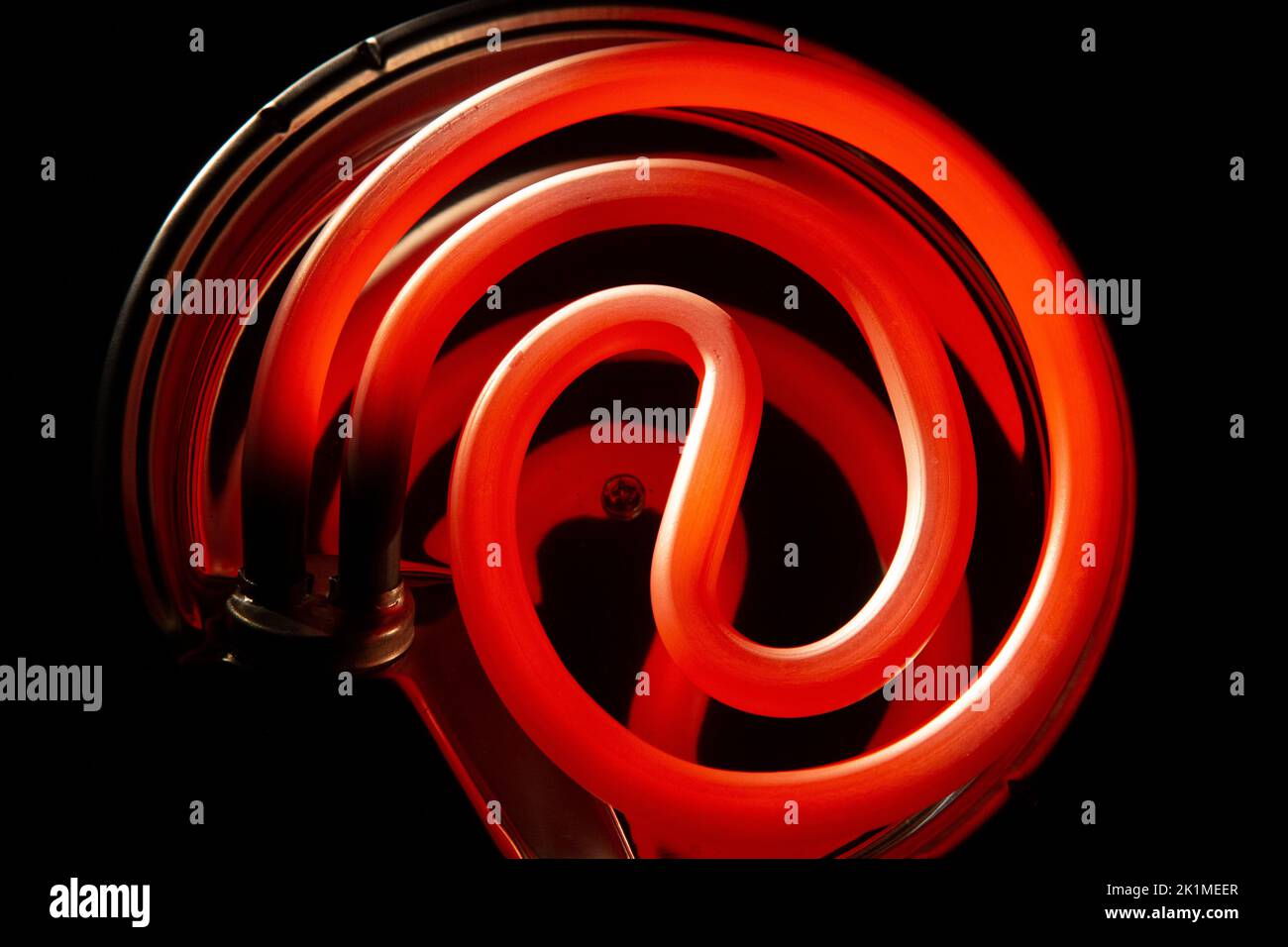 Red hot electric stove on a dark background Stock Photo - Alamy