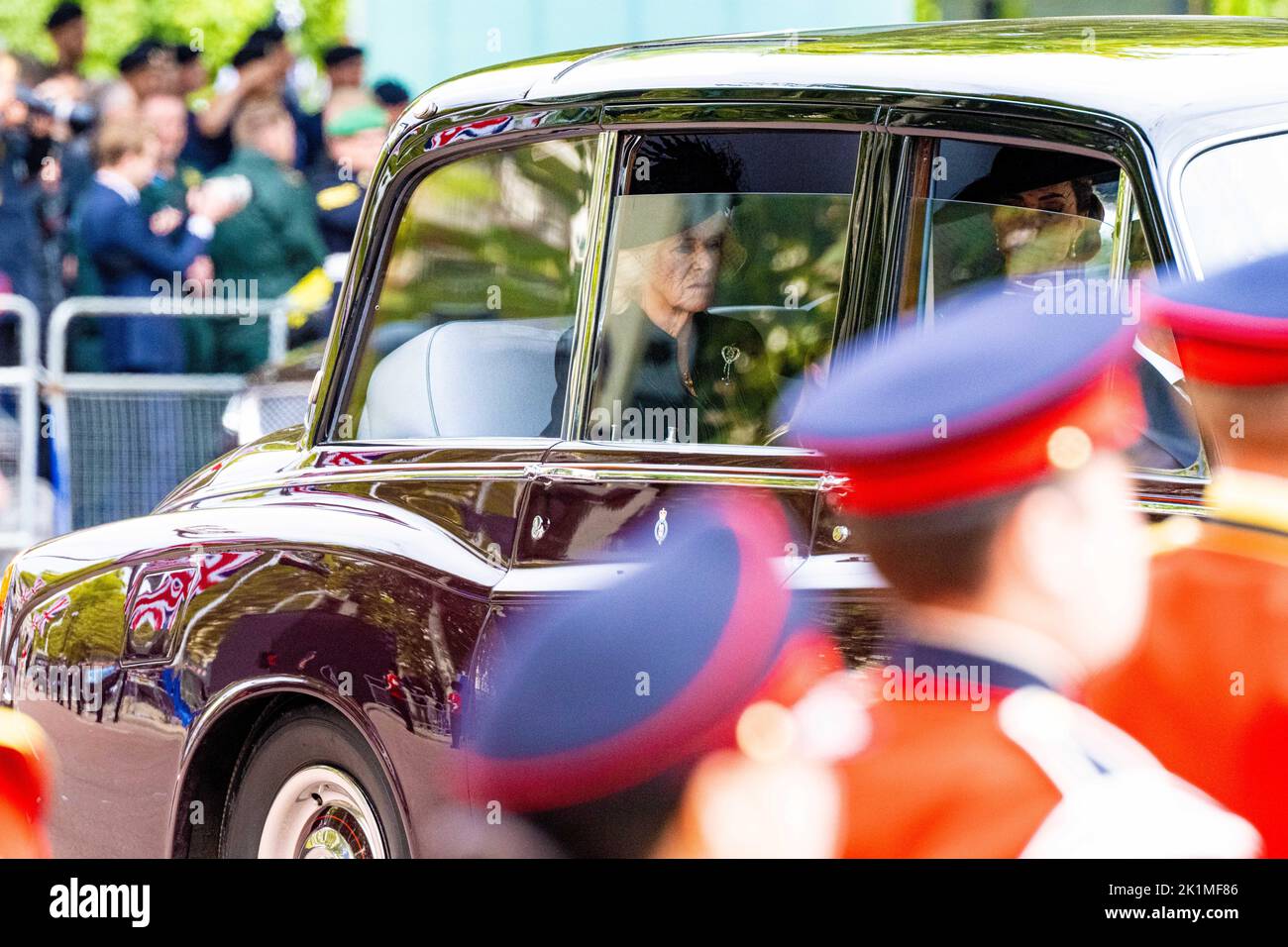 Queen Consort Camilla follow Her Majesty the Queen's coffin on foot as ...