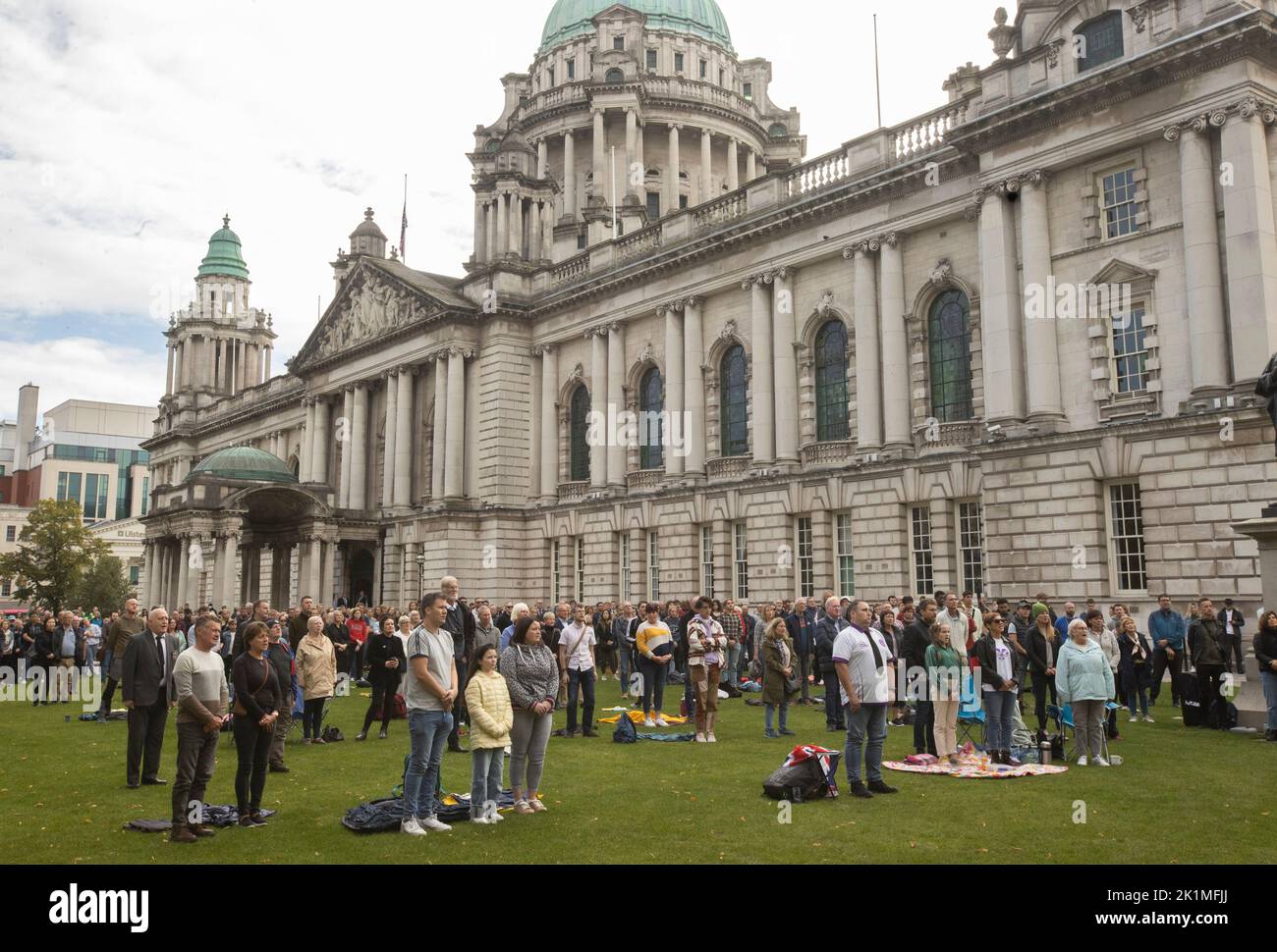 People in the grounds of Belfast City Hall watch Queen Elizabeth II ...