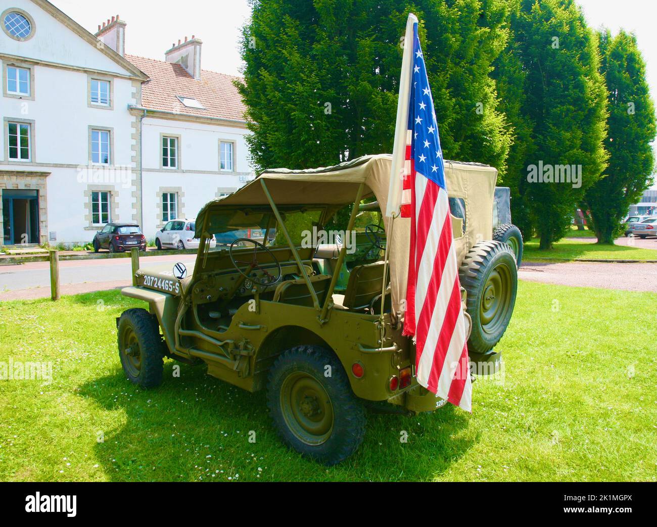An old American jeep supporting the American flag at the Port of ...