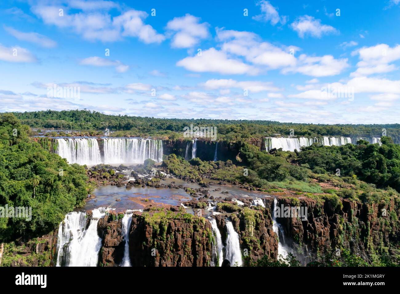 A beautiful landscape of the famous Iguazu falls in Brazil on a sunny ...