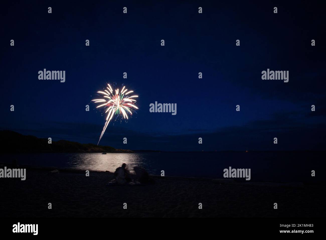 A scenic view of fireworks in the sky at night Stock Photo - Alamy