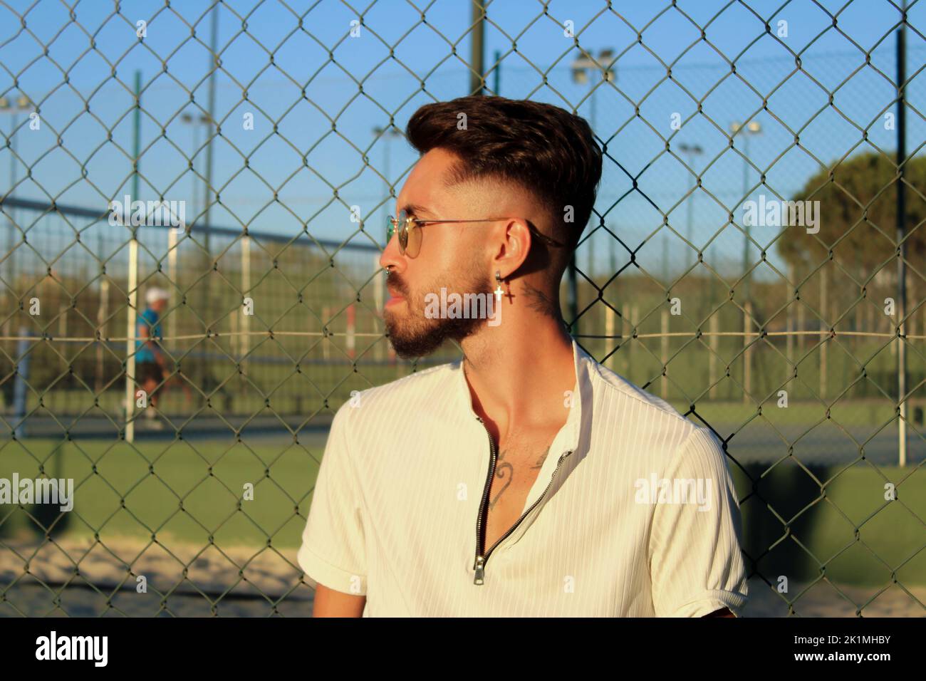 A handsome male in white t-shist on the street Stock Photo - Alamy