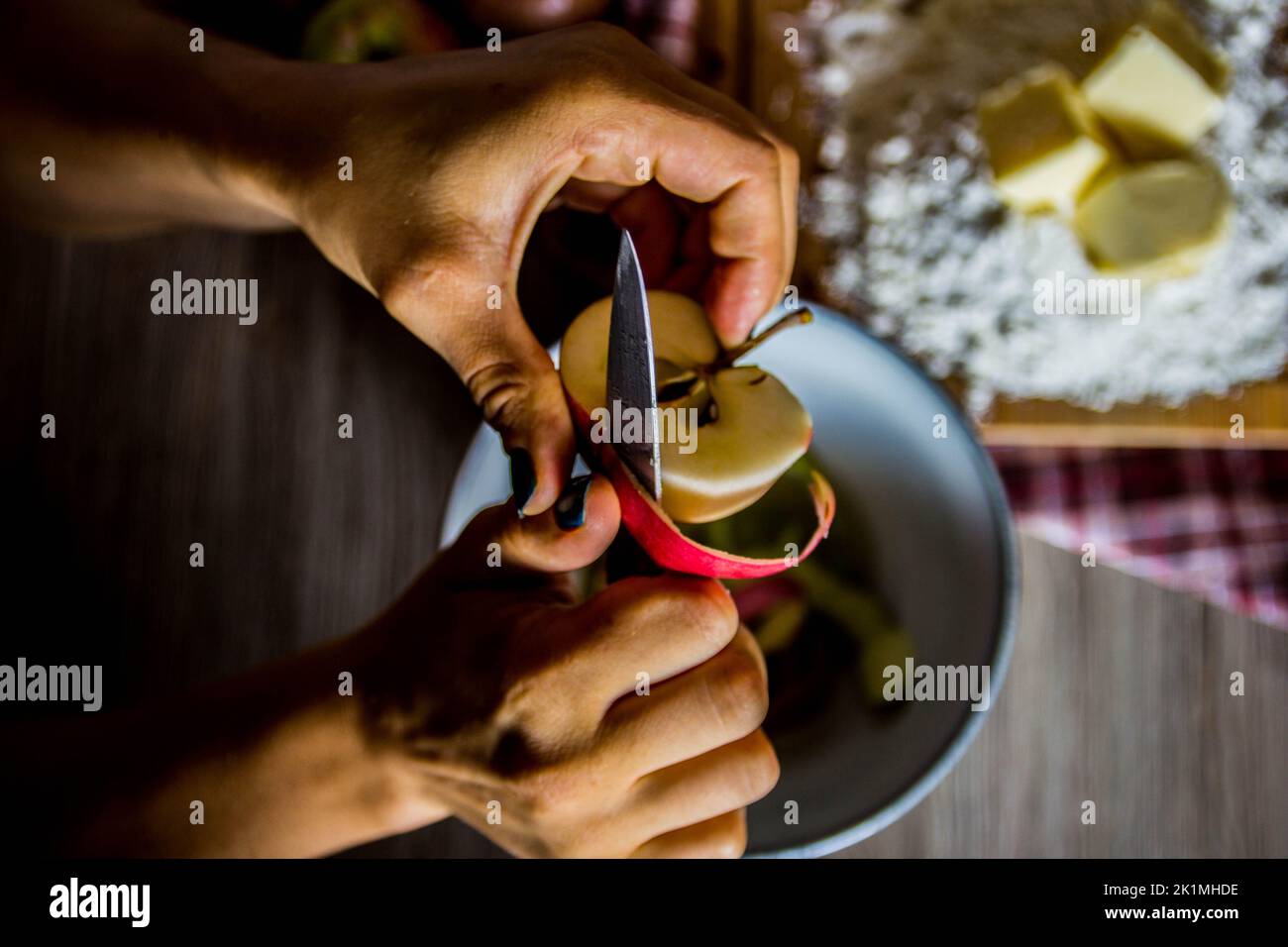 The hands of a woman peeling an apple for a pie Stock Photo - Alamy