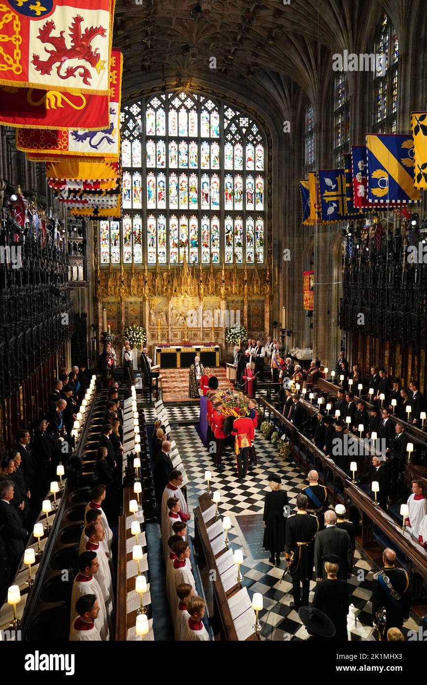 The coffin arrives, followed by King Charles III, the Queen Consort ...