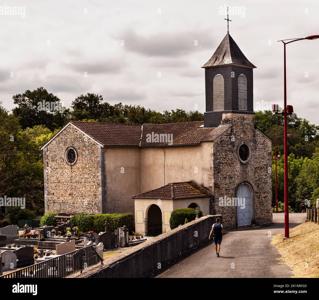 Pilgrim near the Church of Saint-Pierre, Argagnon along the route of ...