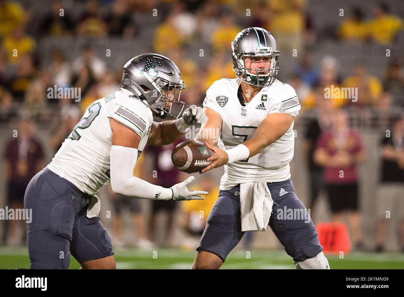 Eastern Michigan Eagles quarterback Taylor Powell (7) hands the ball ...
