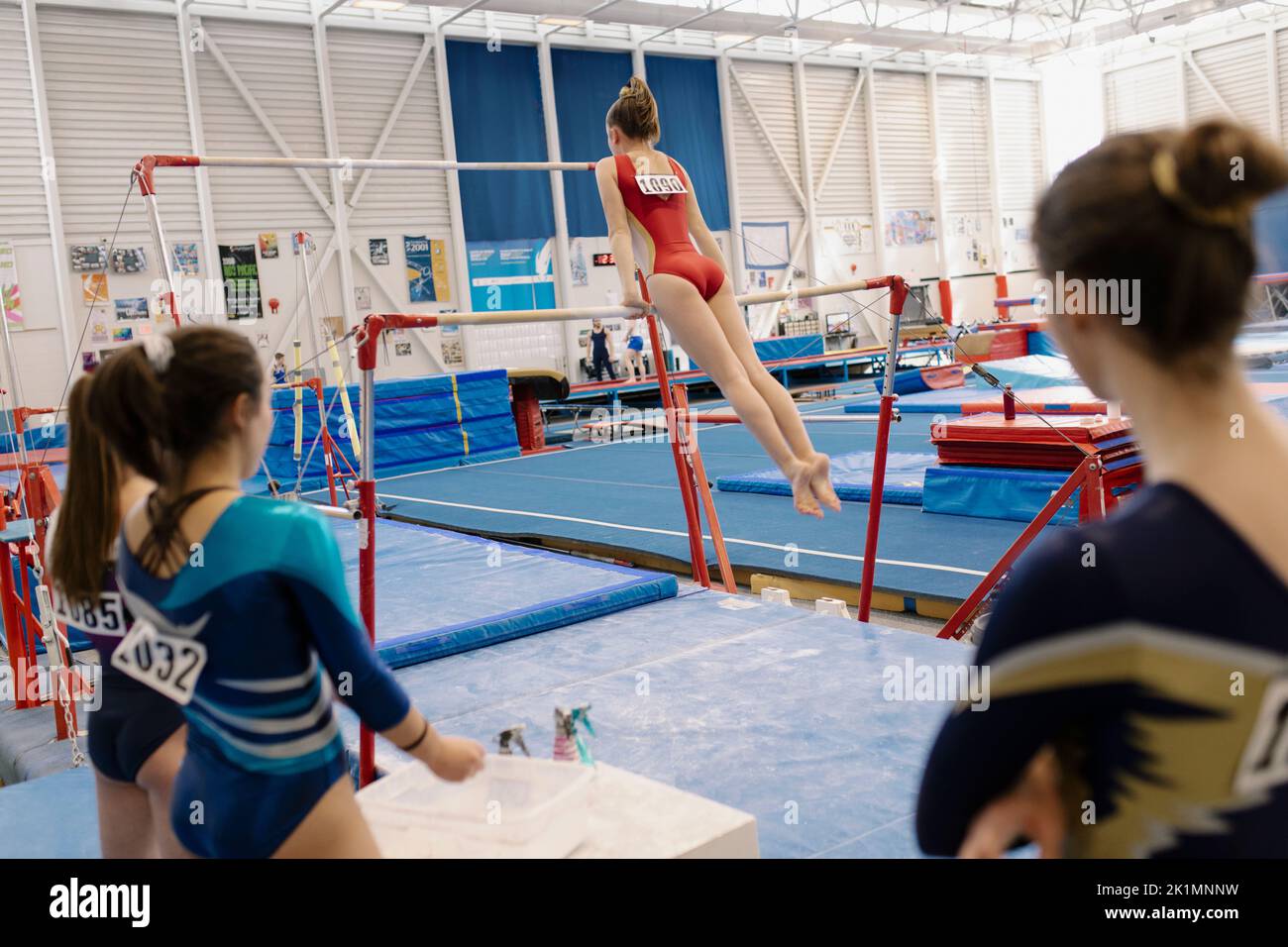 Gymnast on bars hi-res stock photography and images - Alamy