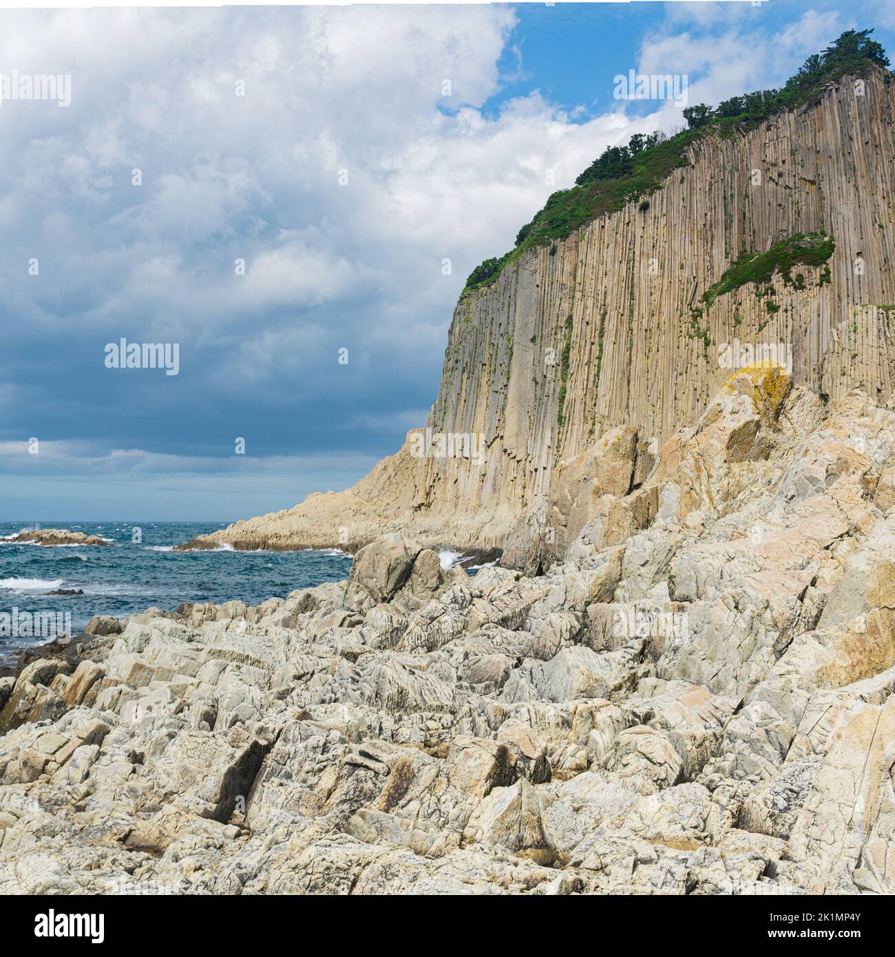 coast of Kunashir Island on Cape Stolbchaty with basalt columned rocks ...