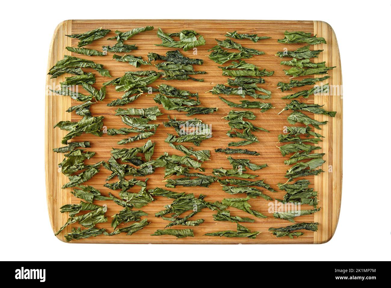 Twisted fermented currant, grape, tea leaves are dried on a wooden ...